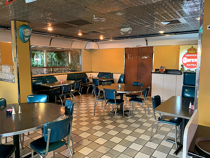 No-frills charm at its finest&mdash;checkered floors, blue vinyl chairs, and yellow walls create the perfect canvas for culinary masterpieces to shine.