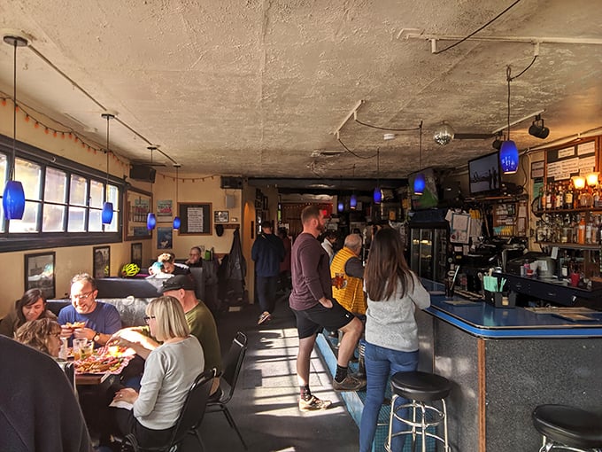 Inside, time stands still in the best possible way. Blue pendant lights, weathered ceiling, and that tiny disco ball create the perfect backdrop for seafood perfection.