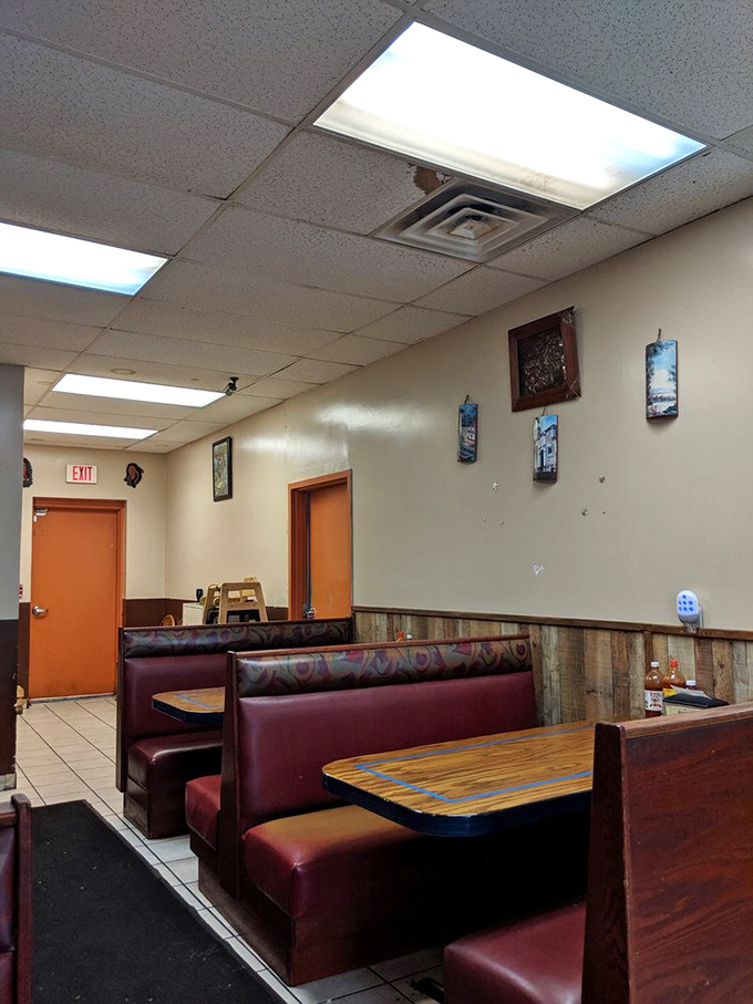 Classic diner-style booths with burgundy upholstery create that perfect "I've discovered something special" feeling that makes neighborhood gems so irresistible.