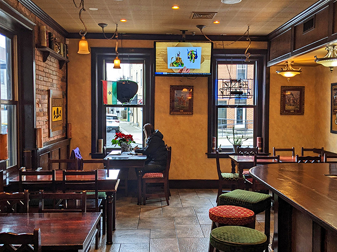 Inside, warm wood tones and exposed brick create that perfect pub atmosphere where time slows down and conversations flow as freely as the drinks.