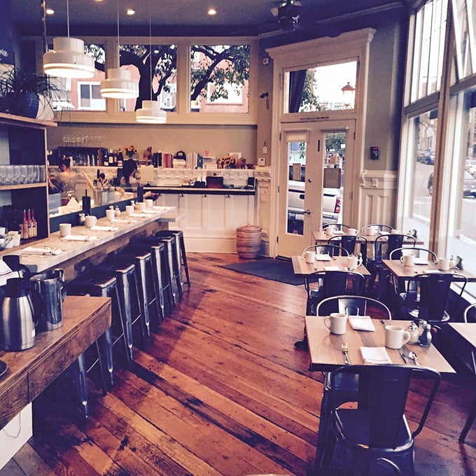 Warm wooden floors, natural light, and minimalist charm create the breakfast nook of your dreams. No wonder people line up!