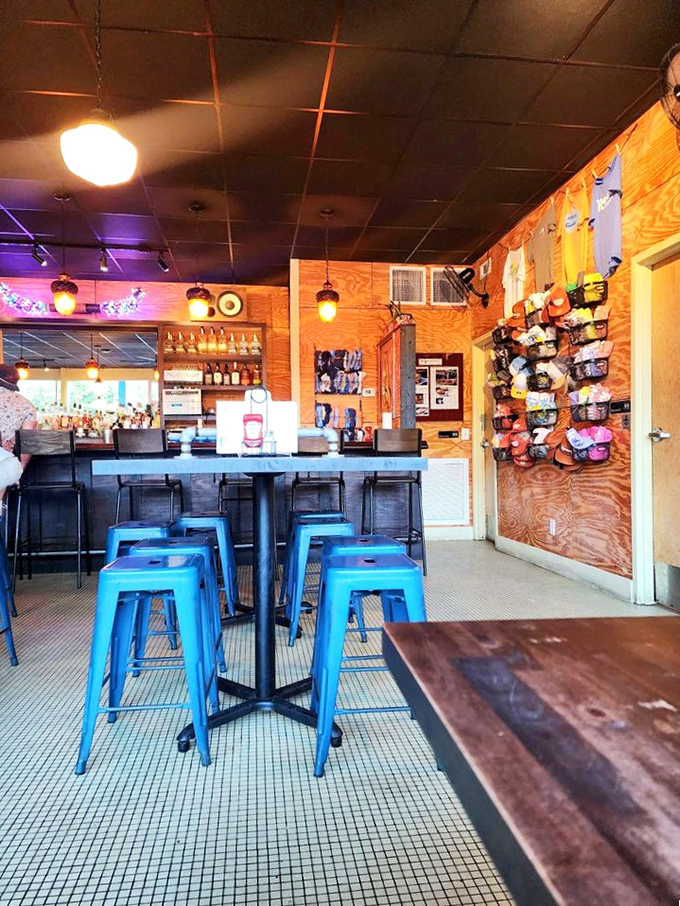 Industrial-chic meets comfort food haven. Those blue stools aren't just seating&mdash;they're front-row tickets to burger nirvana.