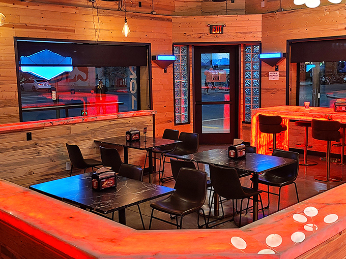 Warm wood paneling bathed in devilish red light &ndash; the perfect ambiance for contemplating just how much spice you can actually handle.