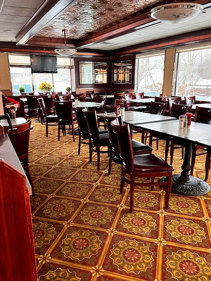 Step inside and feast your eyes on the vintage charm &ndash; ornate tin ceiling, rich wood paneling, and patterned floors that whisper "stay awhile." Classic Connecticut diner ambiance at its finest.