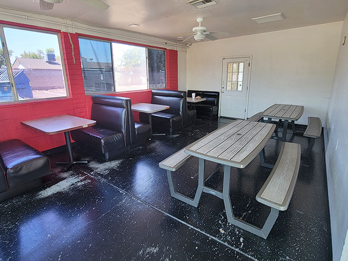 Red-trimmed windows and simple seating tell you everything: this joint cares more about what's on your plate than what's on their walls.