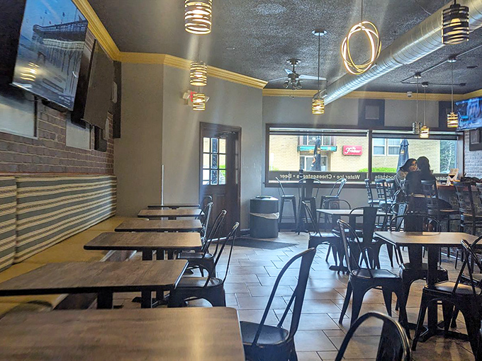 Industrial-chic meets comfort in this no-nonsense dining room. The pendant lighting casts the perfect glow for serious sandwich contemplation.