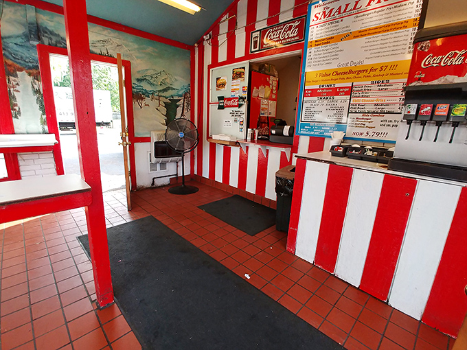 Step inside and the carnival continues&mdash;red and white stripes frame a no-nonsense interior where serious french fry business happens daily.