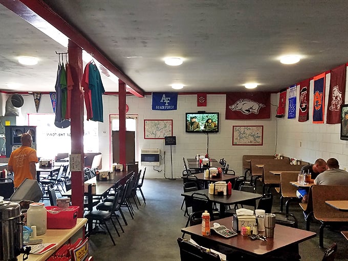 College football reigns supreme inside, where team pennants create a colorful canopy above tables where serious eating business happens daily. 