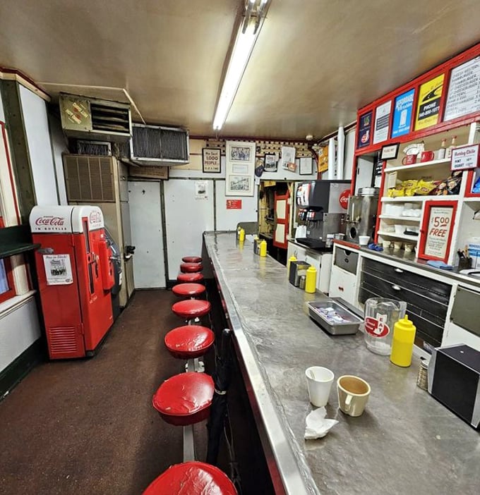Ten red stools lined up like patient soldiers, waiting for the next wave of hungry patrons to experience a slice of Americana at its most authentic.