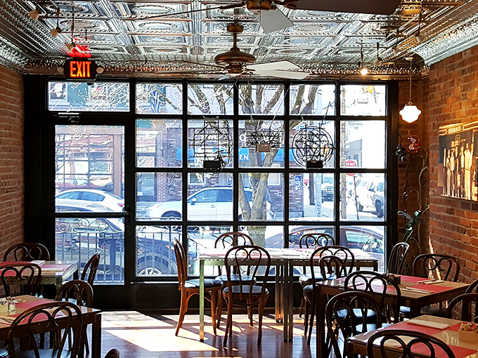 Tin ceilings, exposed brick, and bentwood chairs create the perfect backdrop for burger epiphanies. No Edison bulbs needed when the food shines this bright.