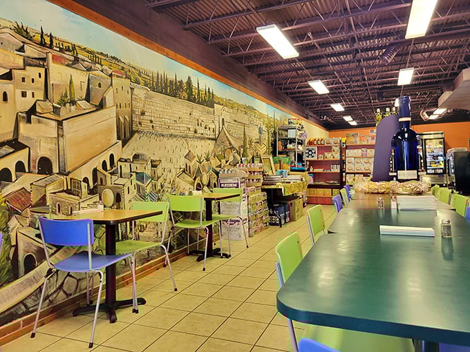 A stunning Jerusalem mural transforms this simple dining space into a cultural journey, with colorful chairs that say "stay awhile" rather than "we need this table back."