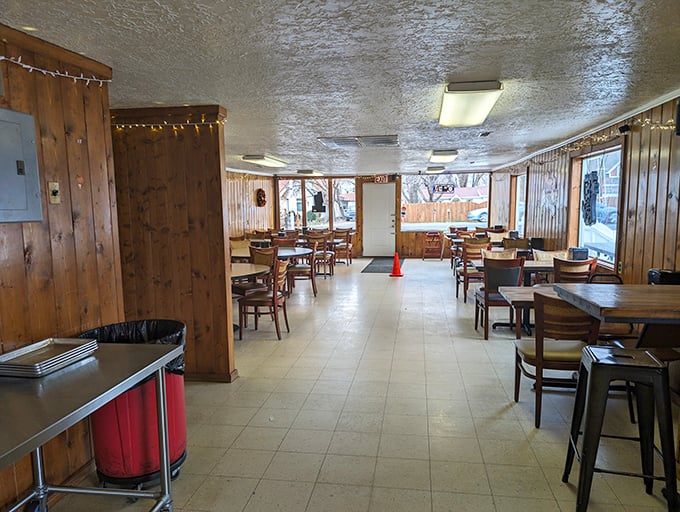 Wood-paneled walls, simple tables, and string lights create the perfect backdrop for food that needs no fancy setting. 