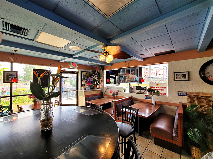 Cozy wooden tables, ceiling fans, and tropical touches create that perfect "somebody's favorite dining room" vibe where the food, not the decor, takes center stage. 