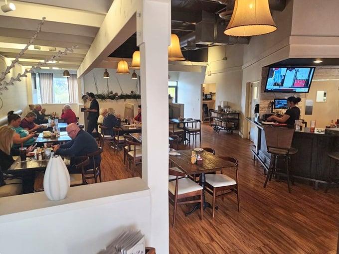 Inside, warm wooden floors and soft pendant lighting create the perfect backdrop for the food drama about to unfold on your plate.