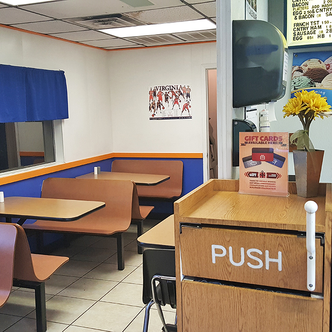 Blue-trimmed booths and simple tables create the perfect no-nonsense setting for the serious business of enjoying exceptional fried chicken. 