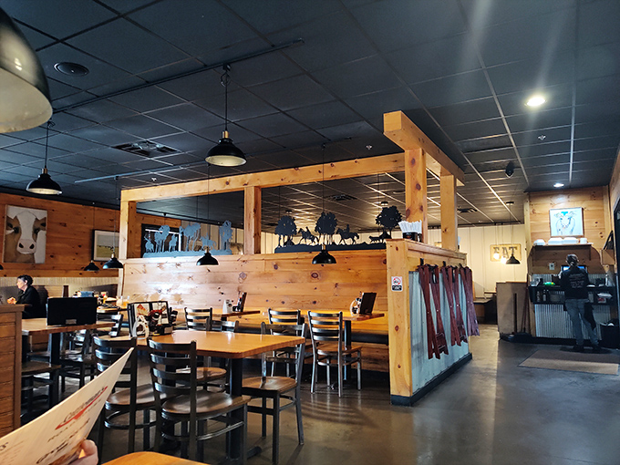 Inside, warm wood paneling and thoughtful dividers create intimate dining spaces without sacrificing the convivial atmosphere that makes a meal memorable.