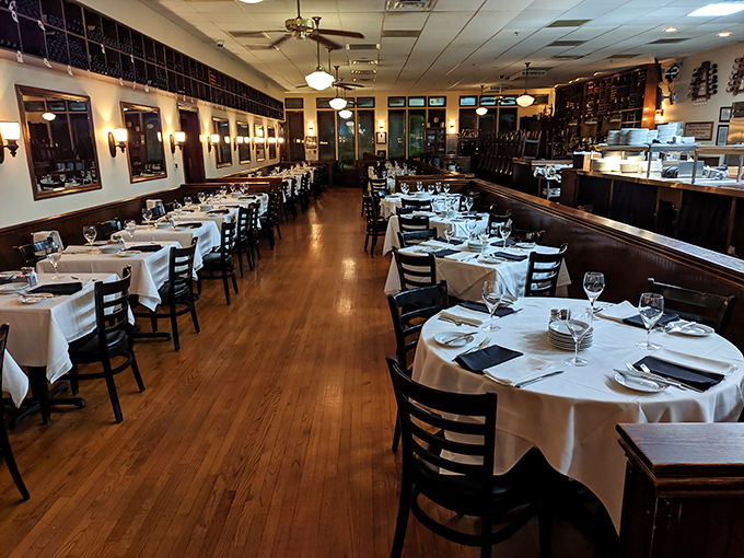 Classic steakhouse elegance meets Southern hospitality in this dining room where white tablecloths aren't just decorative&mdash;they're a canvas for culinary artistry.