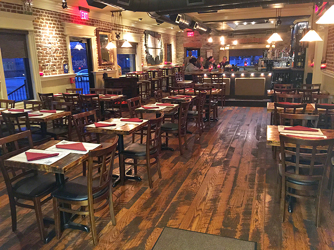 Exposed brick walls, warm wooden floors, and tables set for culinary adventure – this isn't just a dining room, it's the gateway to Southern comfort.