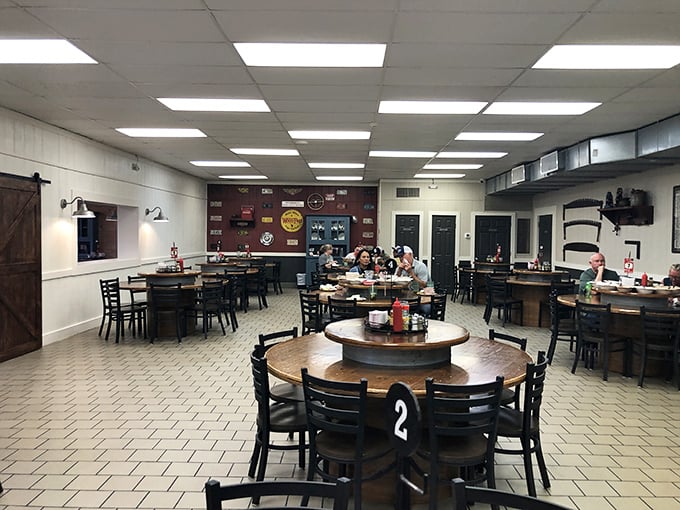 Round tables with lazy Susans set the stage for Buckner's communal dining experience, where strangers become friends over passed platters of Southern classics.