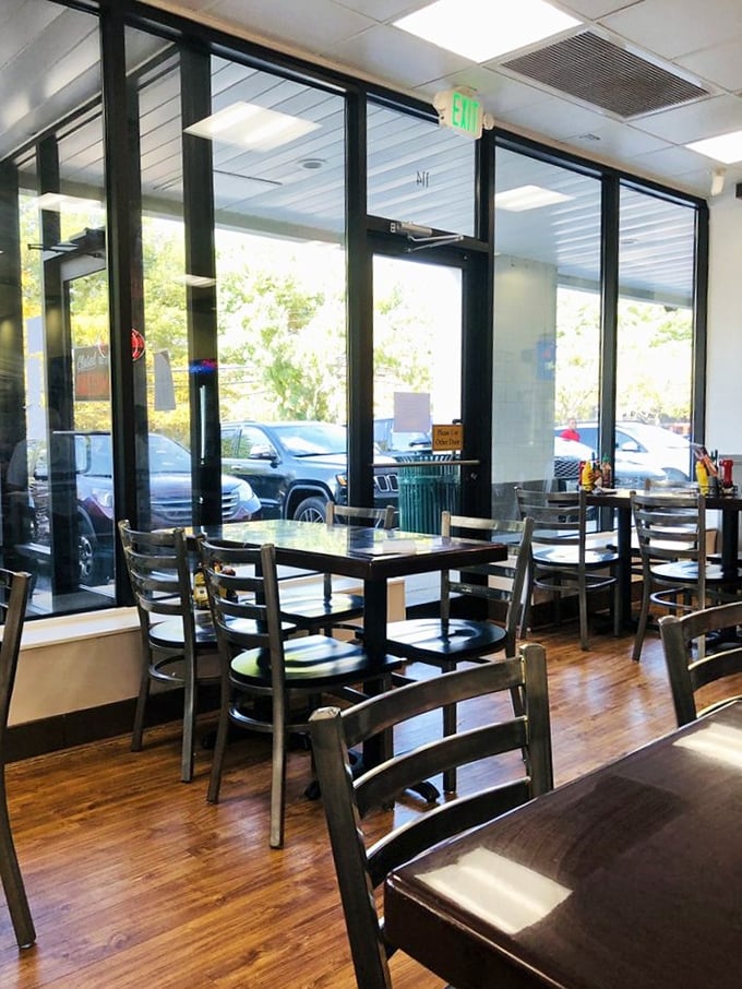 A symphony of natural light streams through floor-to-ceiling windows, illuminating a dining room where comfort meets simplicity and calories fear no judgment.