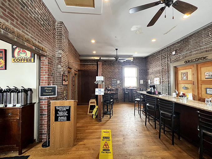 Exposed brick walls and wooden floors tell stories of the past while ceiling fans lazily spin above hungry patrons awaiting breakfast bliss.