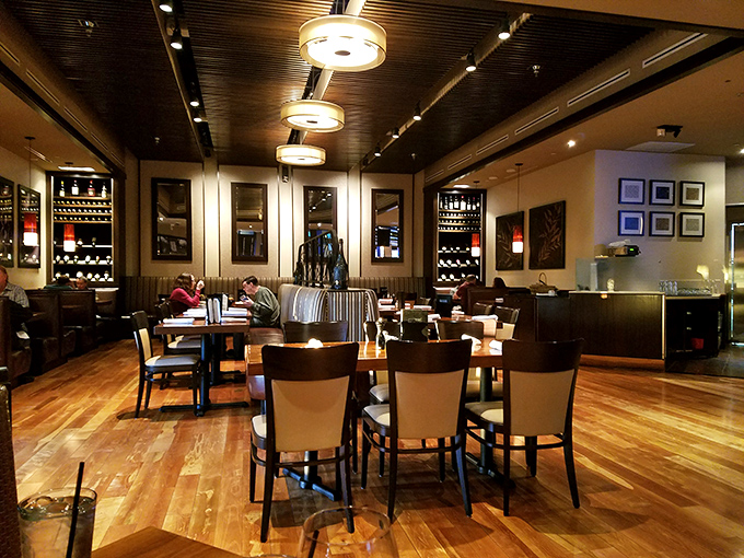 Inside, warm wood floors and thoughtful lighting create the perfect backdrop for memorable meals and conversations. 