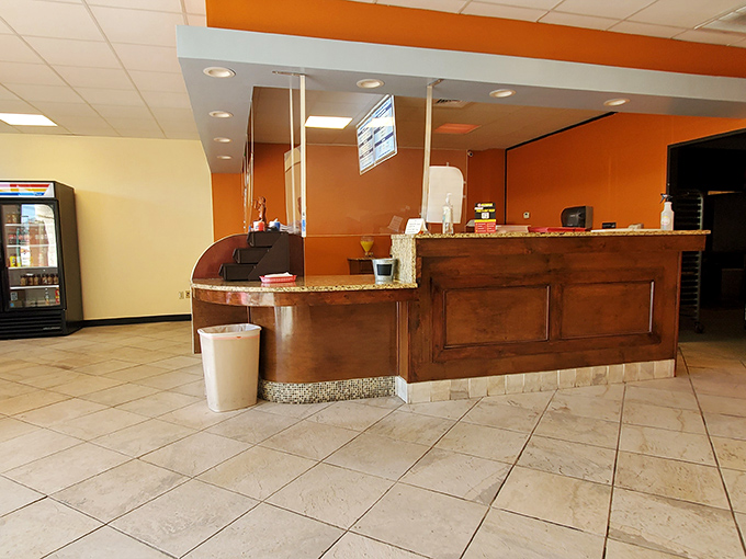 The warm orange walls and wooden counter create a cozy welcome &ndash; like your favorite aunt's kitchen, if your aunt happened to be a donut-making genius.
