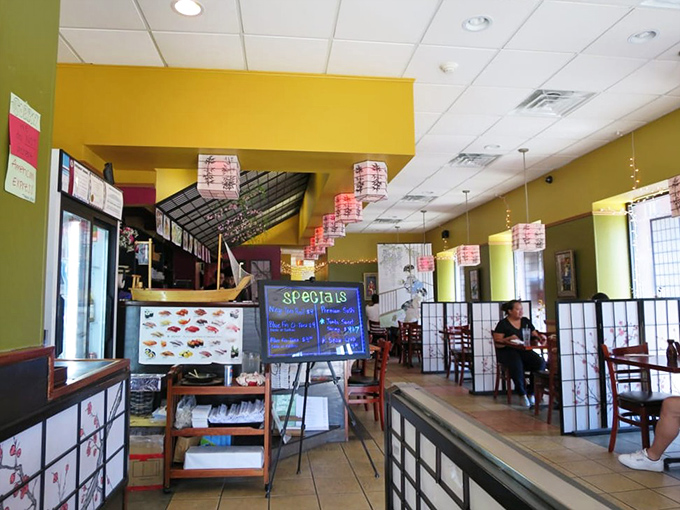 Step inside and the warm yellow walls, traditional lanterns, and intimate dividers transport you straight to Japan &ndash; no passport required.