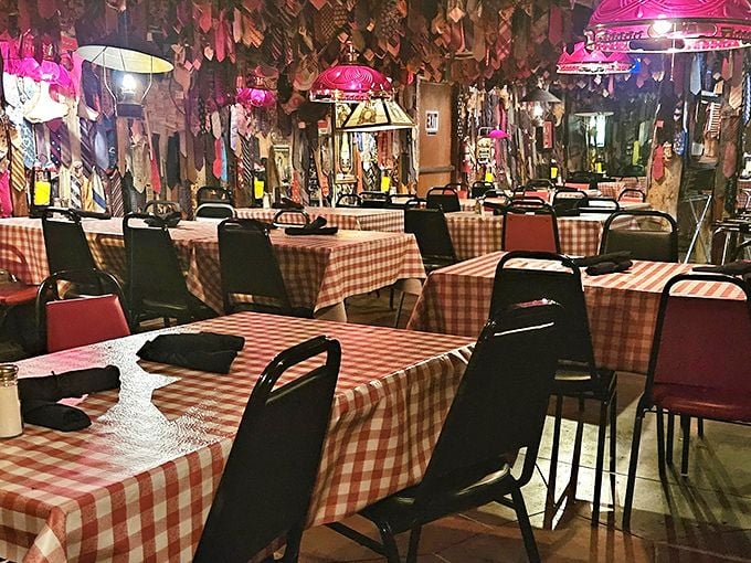 Red checkered tablecloths and vintage charm create dining room magic that Instagram could never capture.