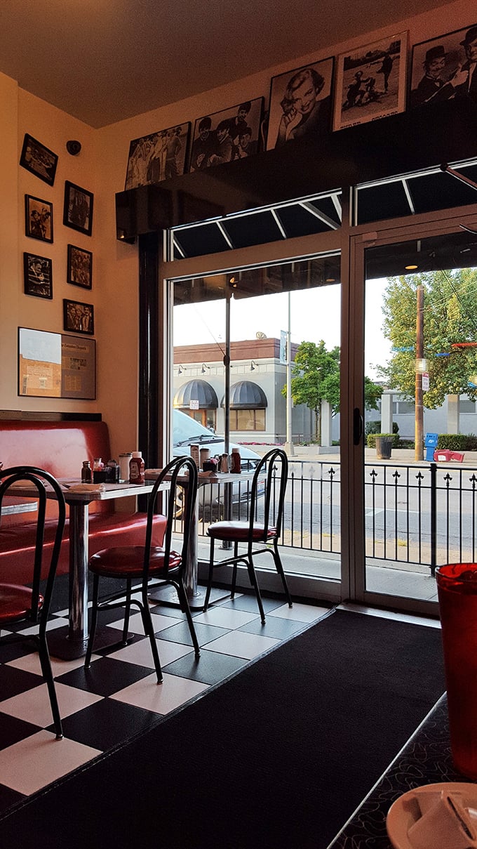 The quintessential American diner experience awaits inside, where checkered floors and vintage photos create a time capsule that's deliciously alive.