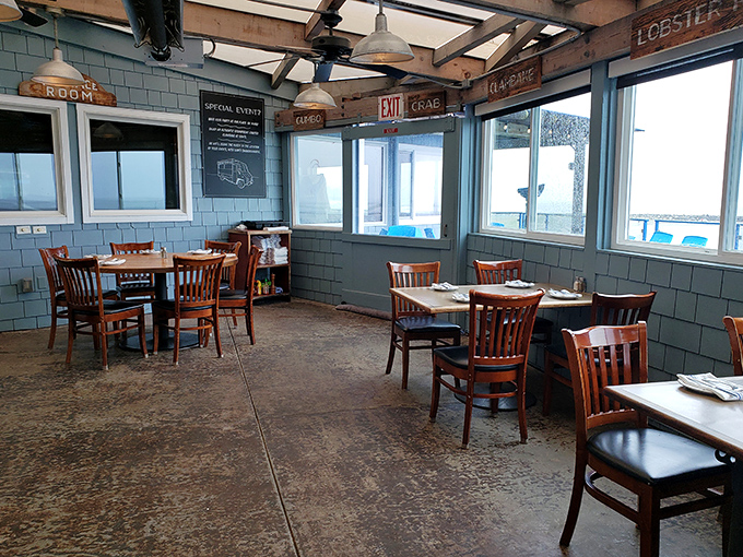Nautical charm meets panoramic ocean views in this dining room where every table feels like you've scored the captain's quarters.
