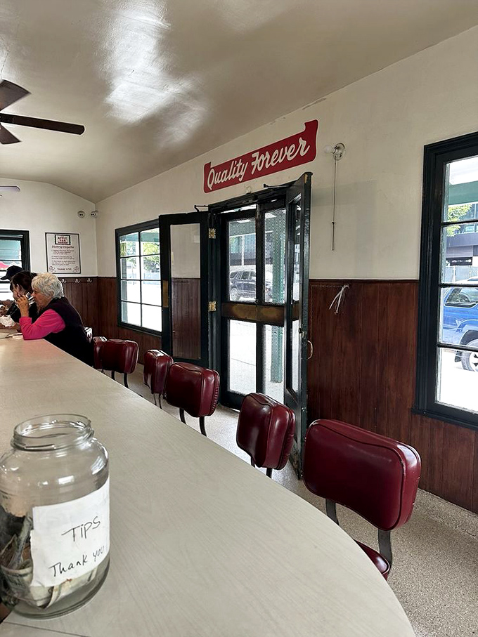 Red vinyl stools and a U-shaped counter &ndash; no tables, no booths, just the democratic simplicity of counter dining where everyone faces the action.
