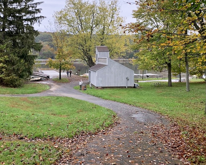 Autumn paints its masterpiece along this winding path, where a simple stroll becomes a journey through nature's art gallery.