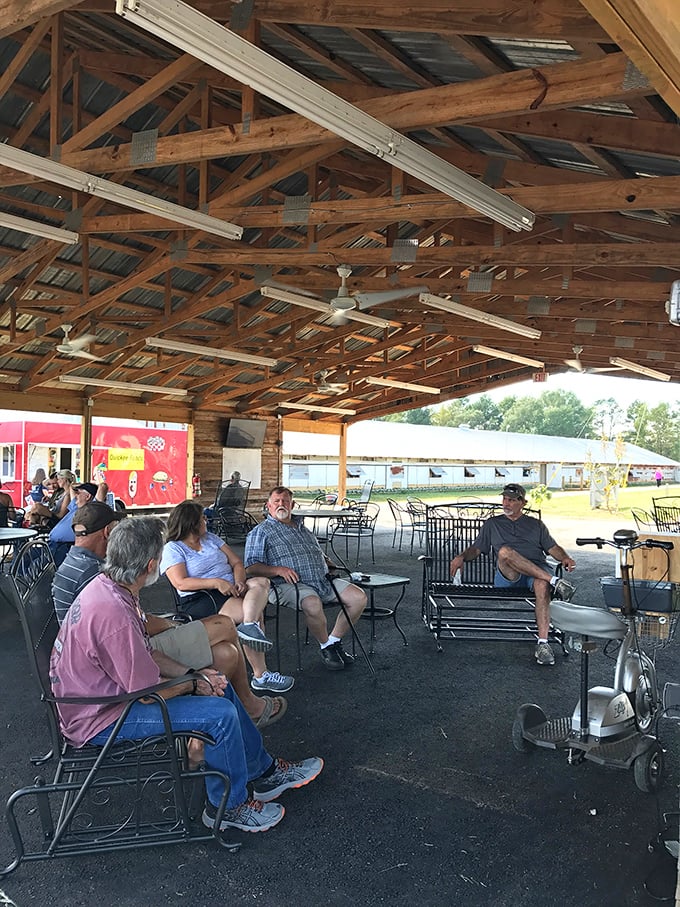 The social hub of swap meet culture. Under rustic wooden beams, shoppers take a breather to swap stories and compare their bargain victories.
