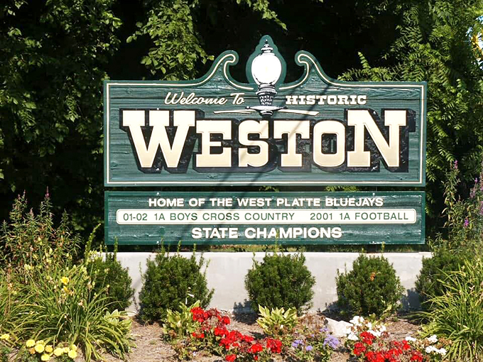 Not just a sign, but a promise. Weston proudly displays its small-town achievements alongside its welcome &ndash; because in places like this, community still matters.