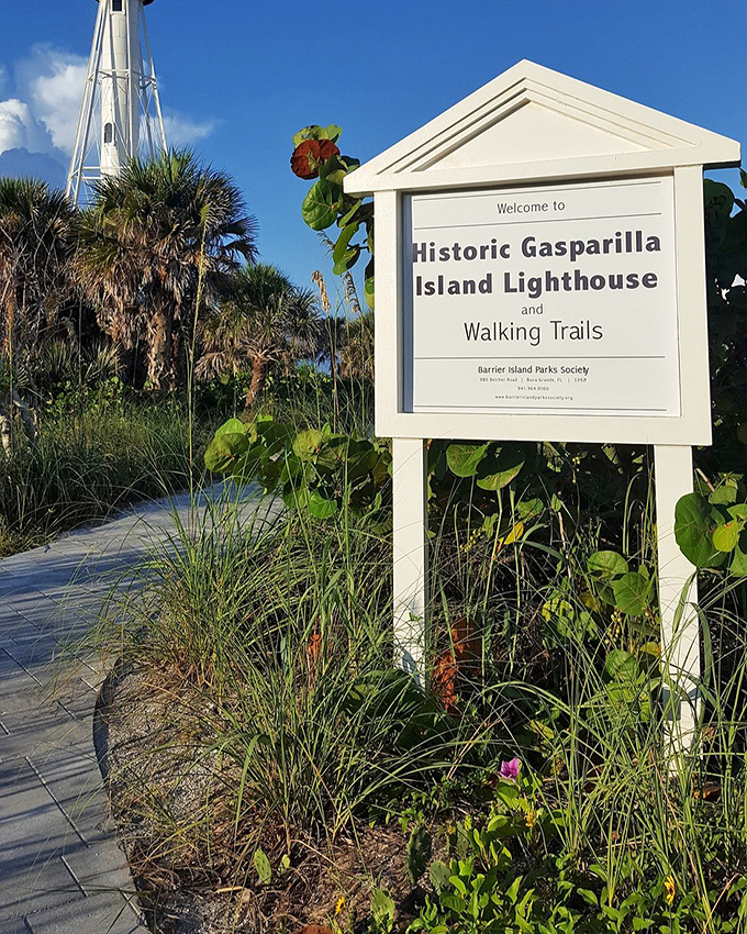 Nature's welcome committee lines the path to history. Sea oats and native plants create a quintessential Florida greeting that whispers, "Slow down, you're on island time now."