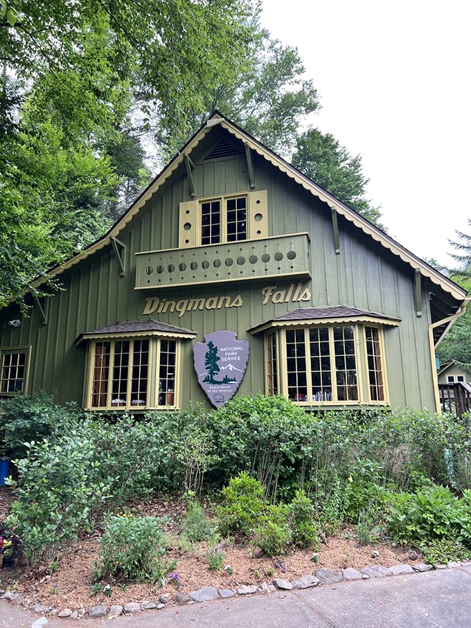 This charming visitor center welcomes waterfall seekers with rustic charm and essential trail information.