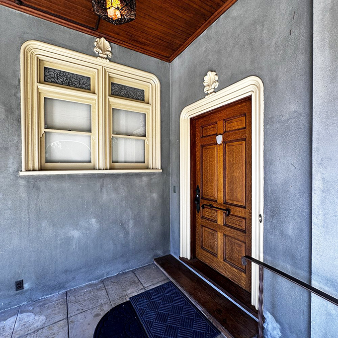 Even the doorways at Kimberly Crest tell stories. This oak entrance with its ornate trim whispers of an era when craftsmanship wasn't optional.