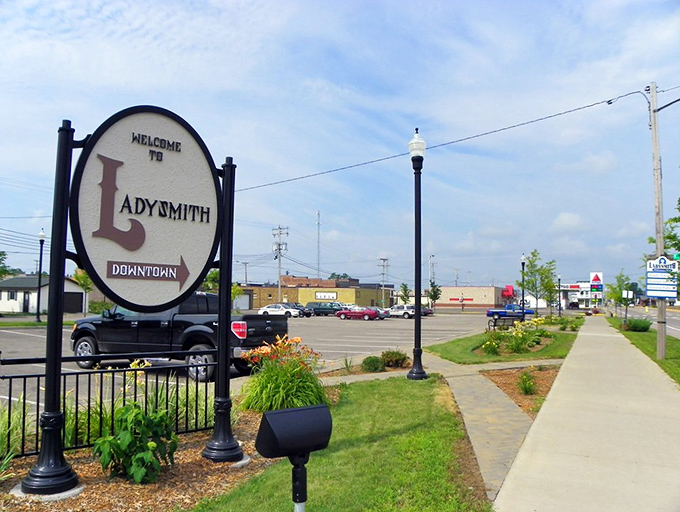 The welcoming sign to downtown Ladysmith stands as a friendly sentinel, promising visitors that yes, life can indeed slow down to a civilized pace.