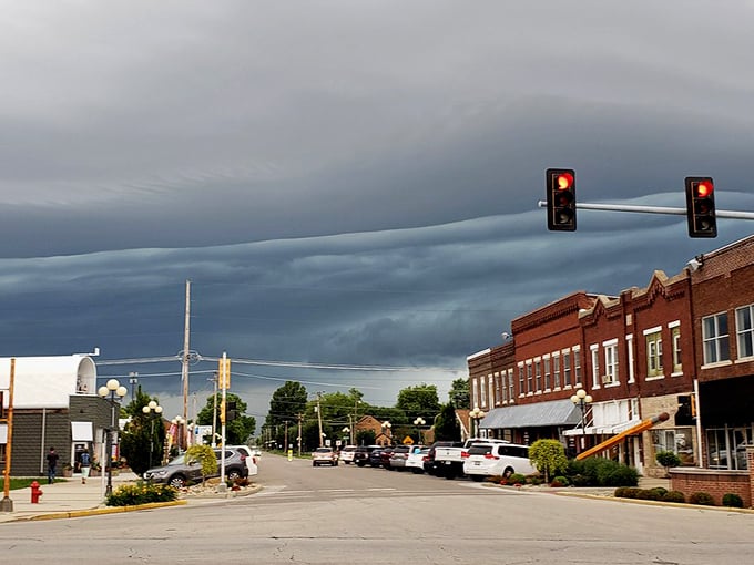 Storm clouds gather dramatically over Casey's historic downtown, adding theatrical flair to an already picturesque Main Street scene.
