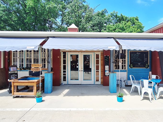 Summer awnings frame the entrance like a portal to simpler times, with turquoise accents adding that perfect touch of mid-century modern flair.