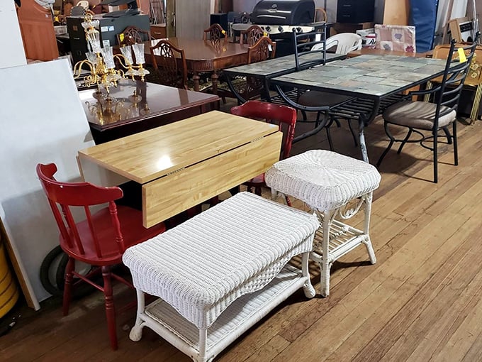 Mid-century meets modern in this furniture tableau. That drop-leaf table has probably hosted more family dinners than your favorite diner has served meatloaf specials.