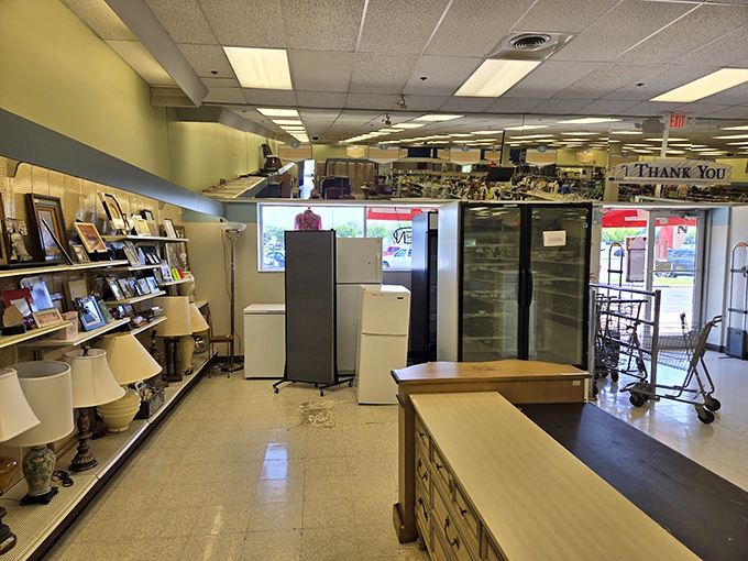 Appliances, lamps, and furniture await new homes in this well-organized section. That vintage refrigerator might have more stories to tell than your grandmother at Thanksgiving dinner.