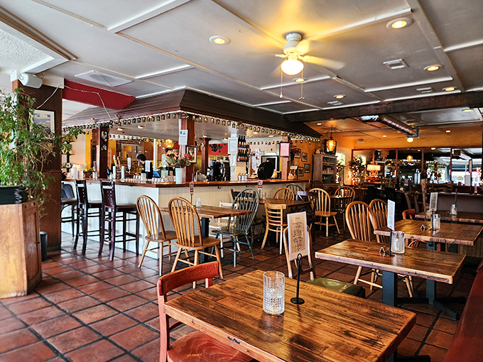 Inside, wooden tables and terra cotta floors create that rare atmosphere where memories are made between bites of extraordinary pizza.