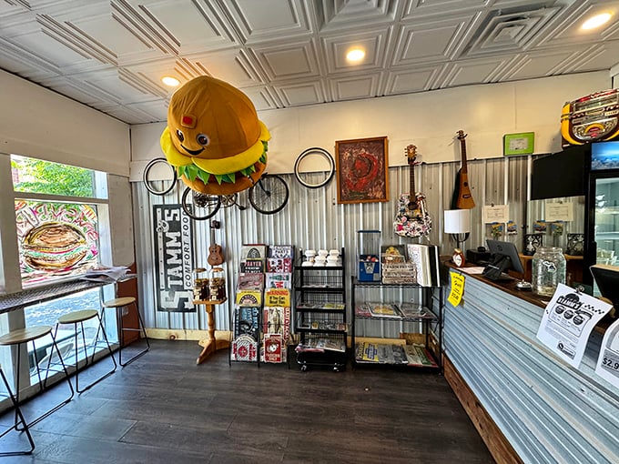 Inside, whimsical decor including a giant burger mascot hanging from the ceiling signals you've entered a place that takes food seriously but itself less so.