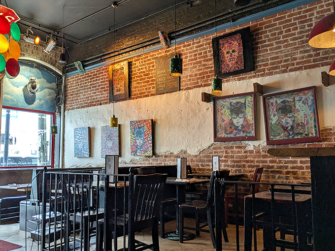 Exposed brick walls showcase local art while high ceilings and industrial touches create that perfect "discovered treasure" vibe every food lover seeks.