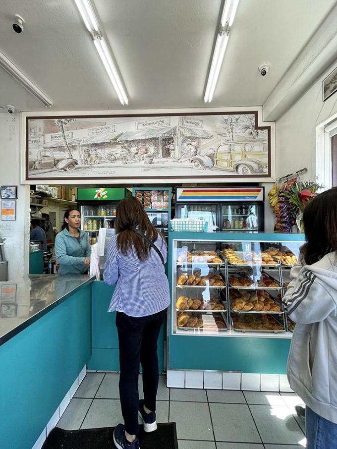 Inside, turquoise counters and no-nonsense display cases let you know this place means business&mdash;donut business, the most delicious kind there is.