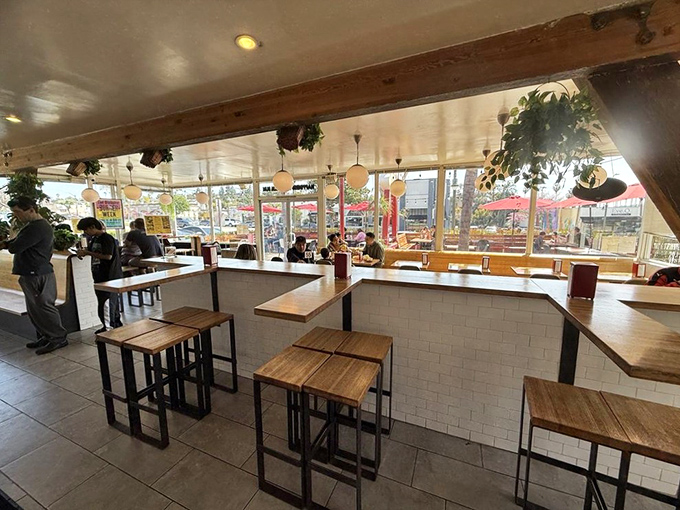 Inside, minimalist wood and white tile create a space where nothing distracts from the main event—the food that's about to change your day.