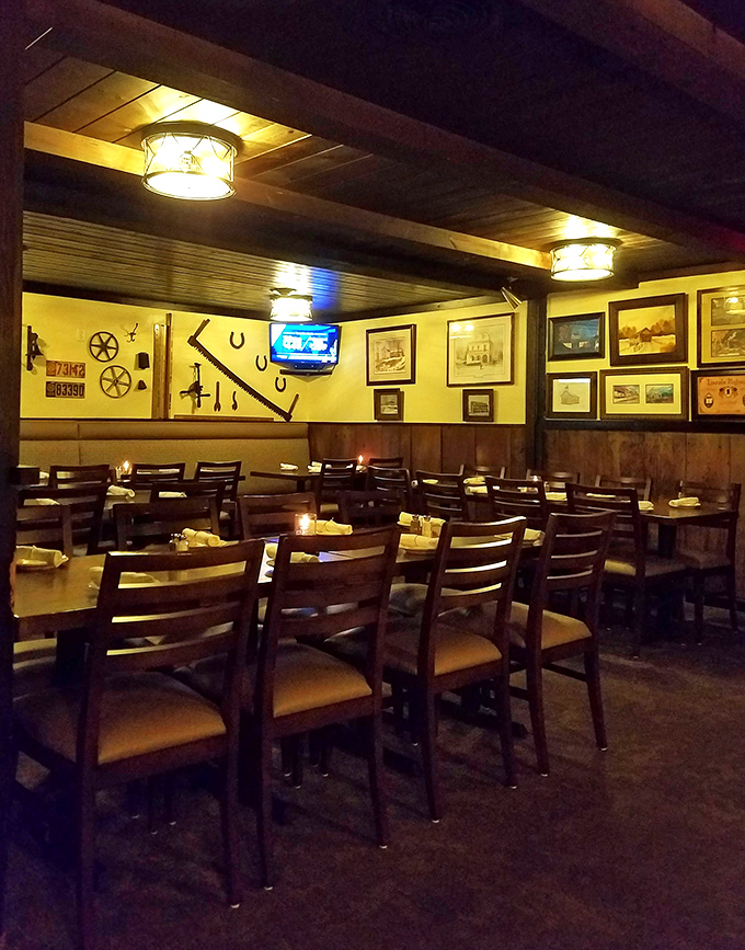 Rustic farm implements adorn walls bathed in amber light, creating the perfect backdrop for carnivorous contemplation and hearty conversation.
