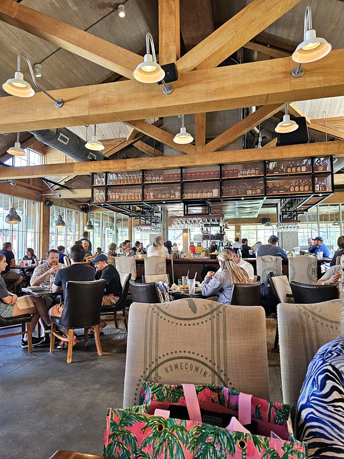 Exposed wooden beams create a cathedral to comfort food, while natural light floods through walls of windows. Rustic elegance that says "stay awhile." 